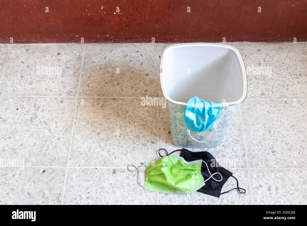 face mask inside a garbage can , end of pandemic concept Stock Photo ...