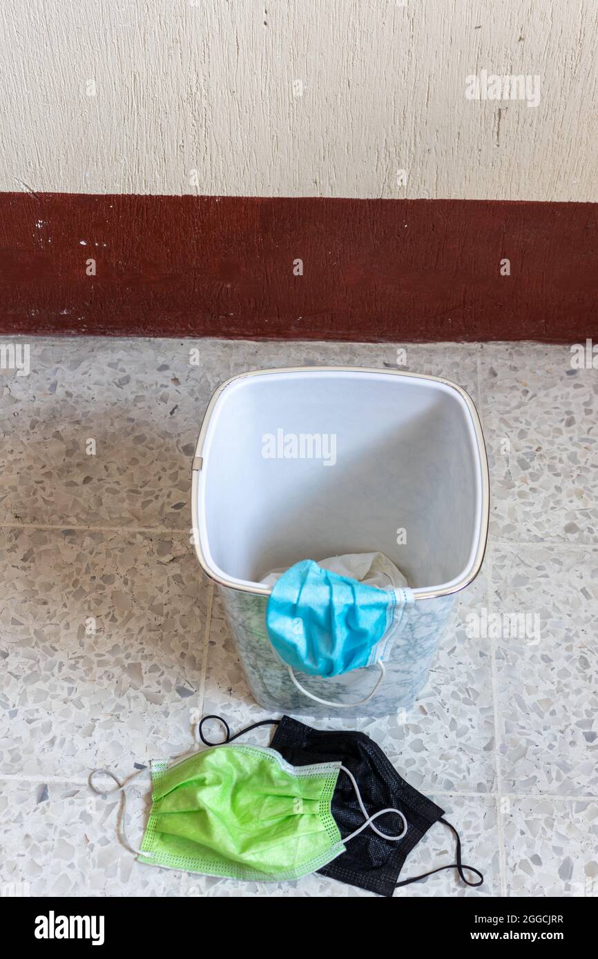 face mask inside a garbage can , end of pandemic concept Stock Photo ...