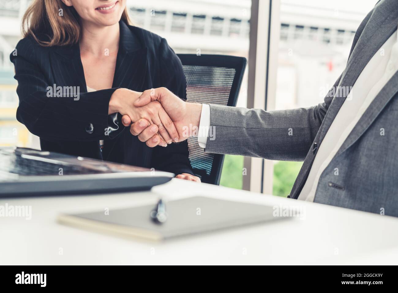 Businessman executive handshake with businesswoman worker in modern ...