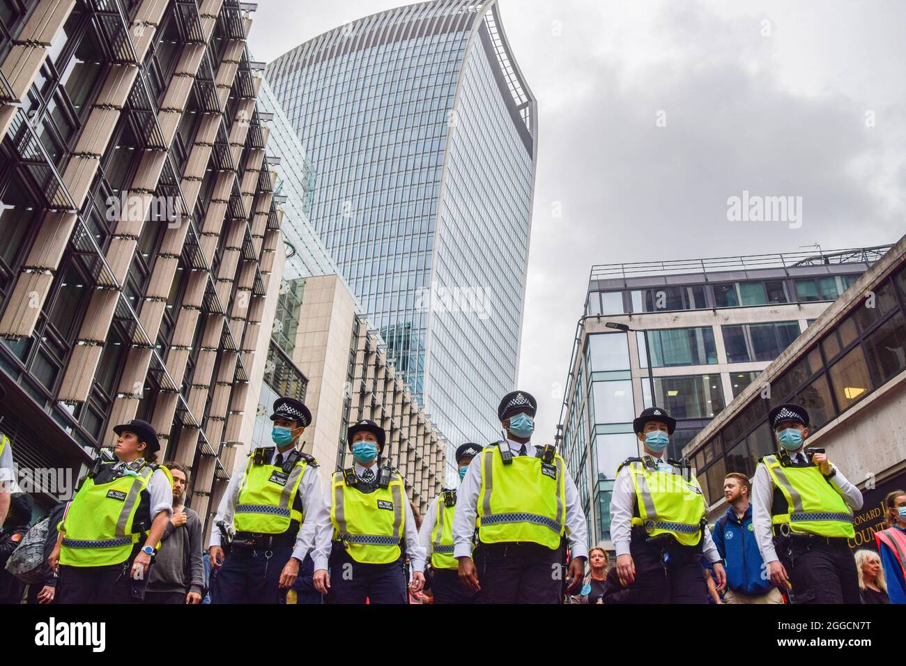 London, UK. 30th Aug, 2021. Police officers stand on the street outside ...