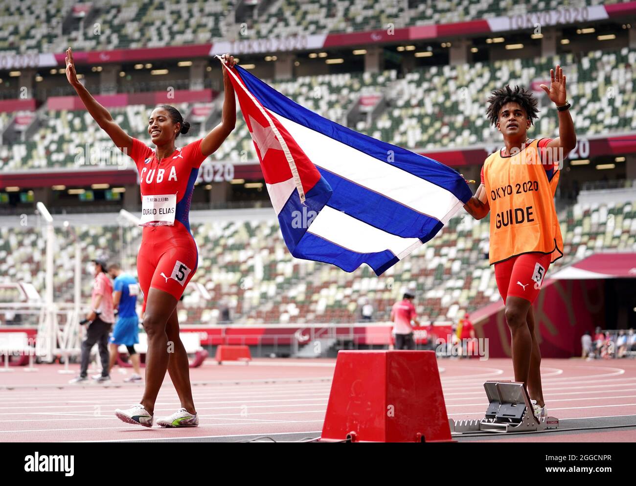 Cuba's Omara Elias Durand and guide Yuniol Kindelan Vargas react after ...
