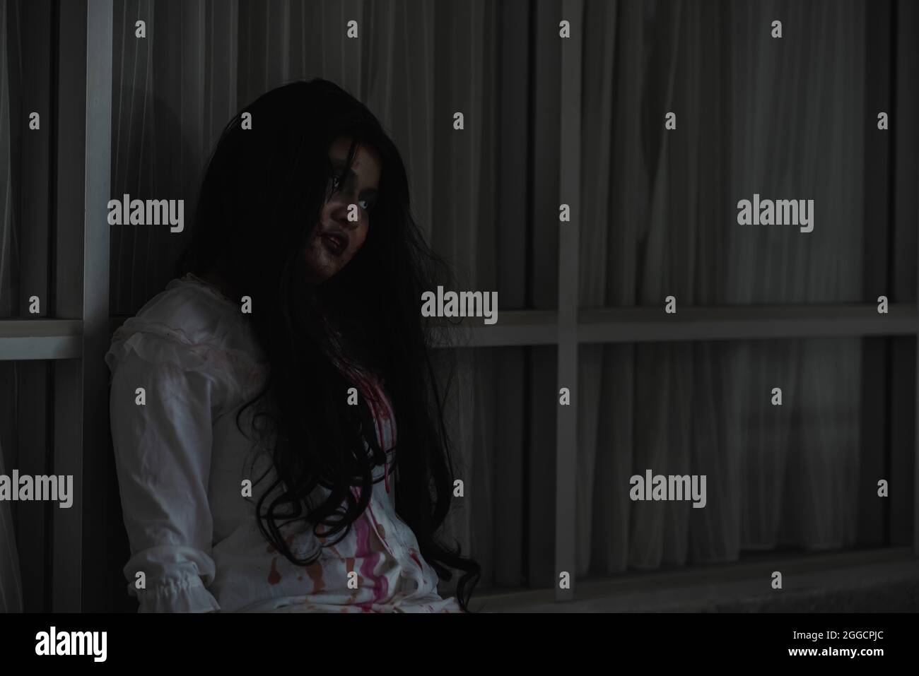 Horror evil woman ghost creepy in a dark room at house. The female ...