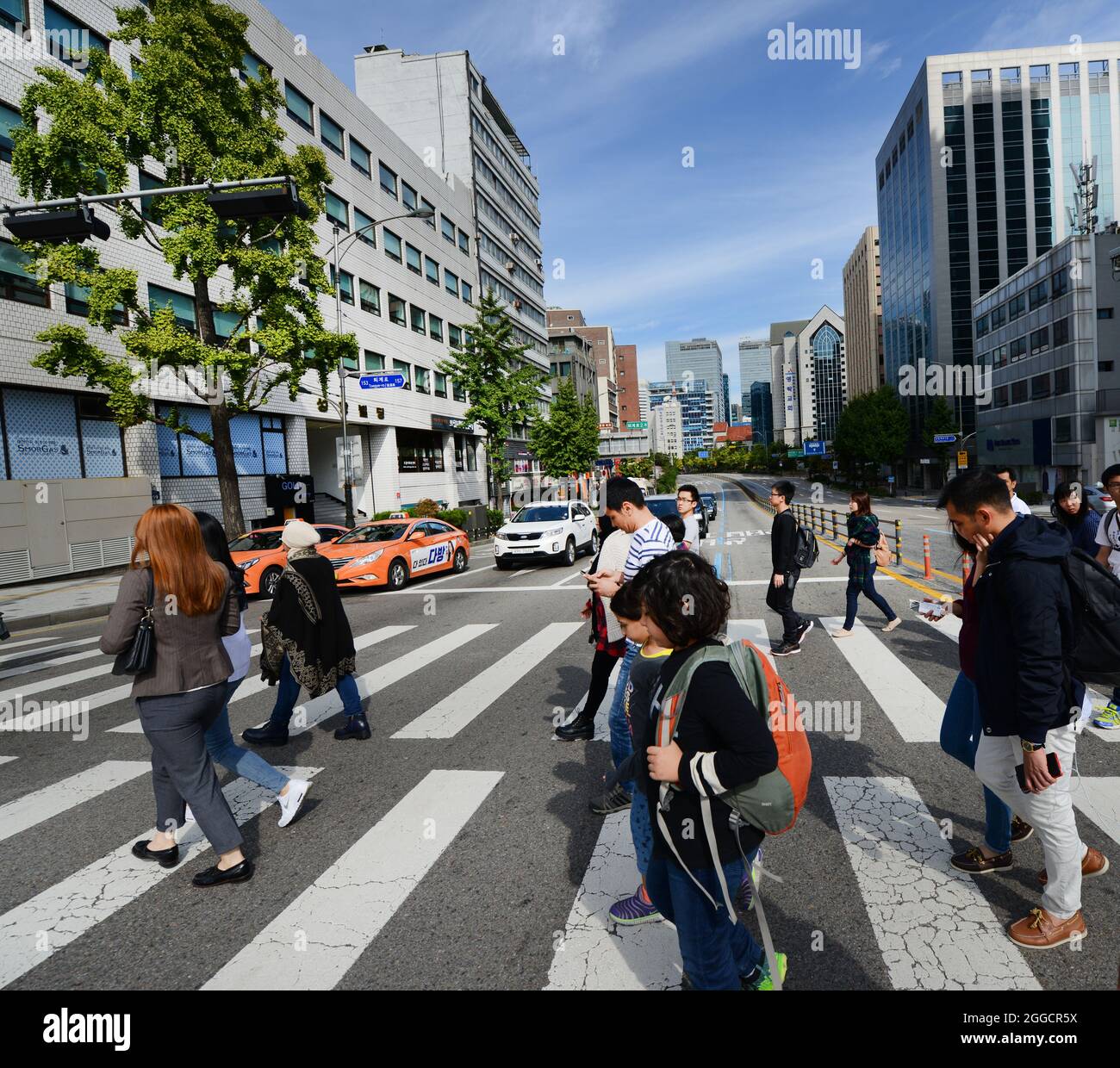 Pedestrians crossing the road in Myeongdong, Seoul, South Korea Stock ...
