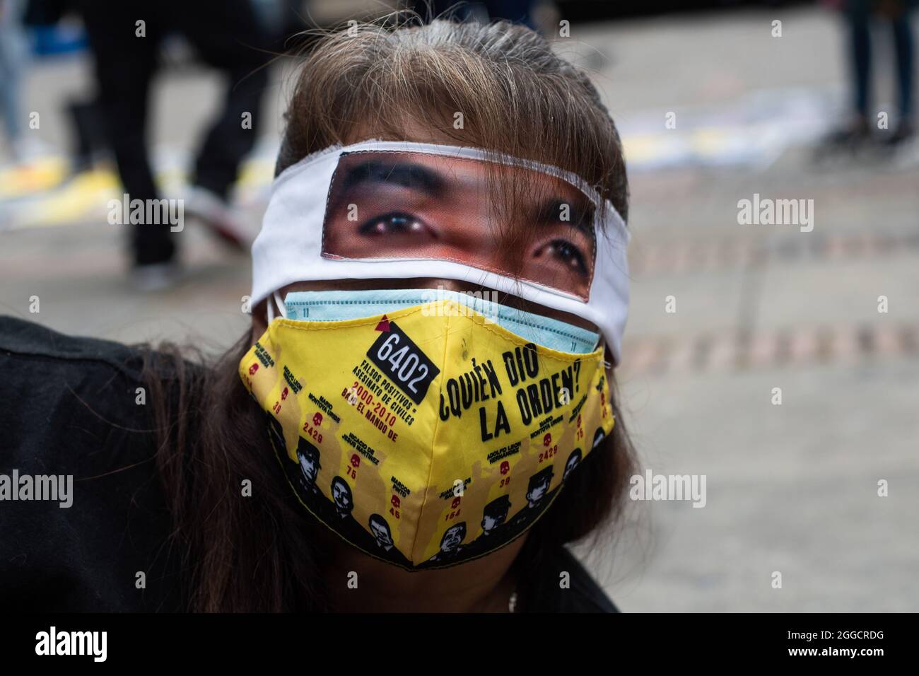 Bogota, Colombia. 30th Aug, 2021. A women lays on the ground wearing a ...
