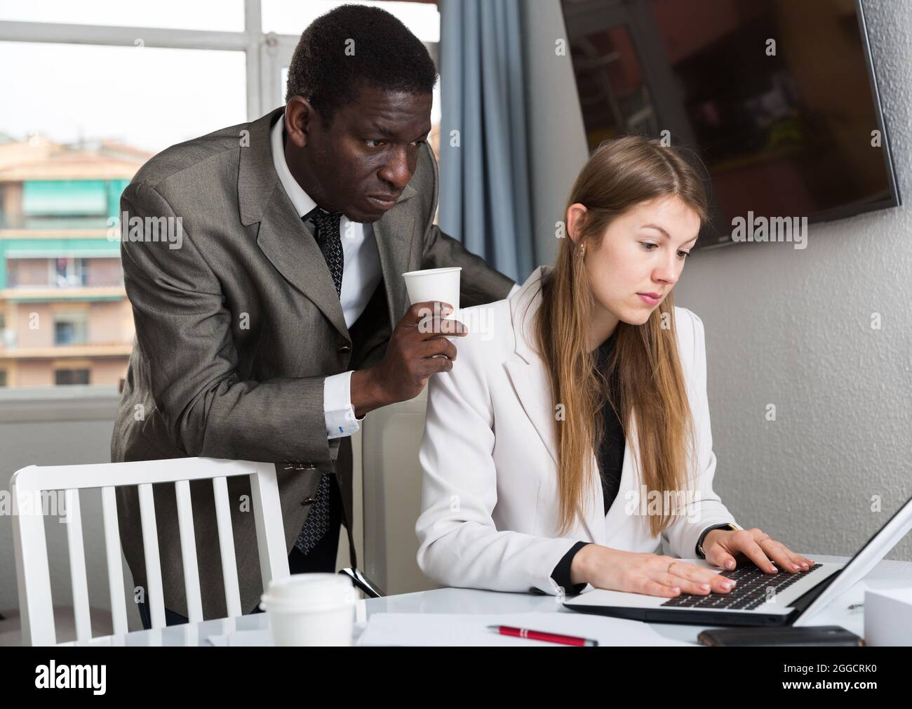 Male manager helping colleagues project hi-res stock photography and ...