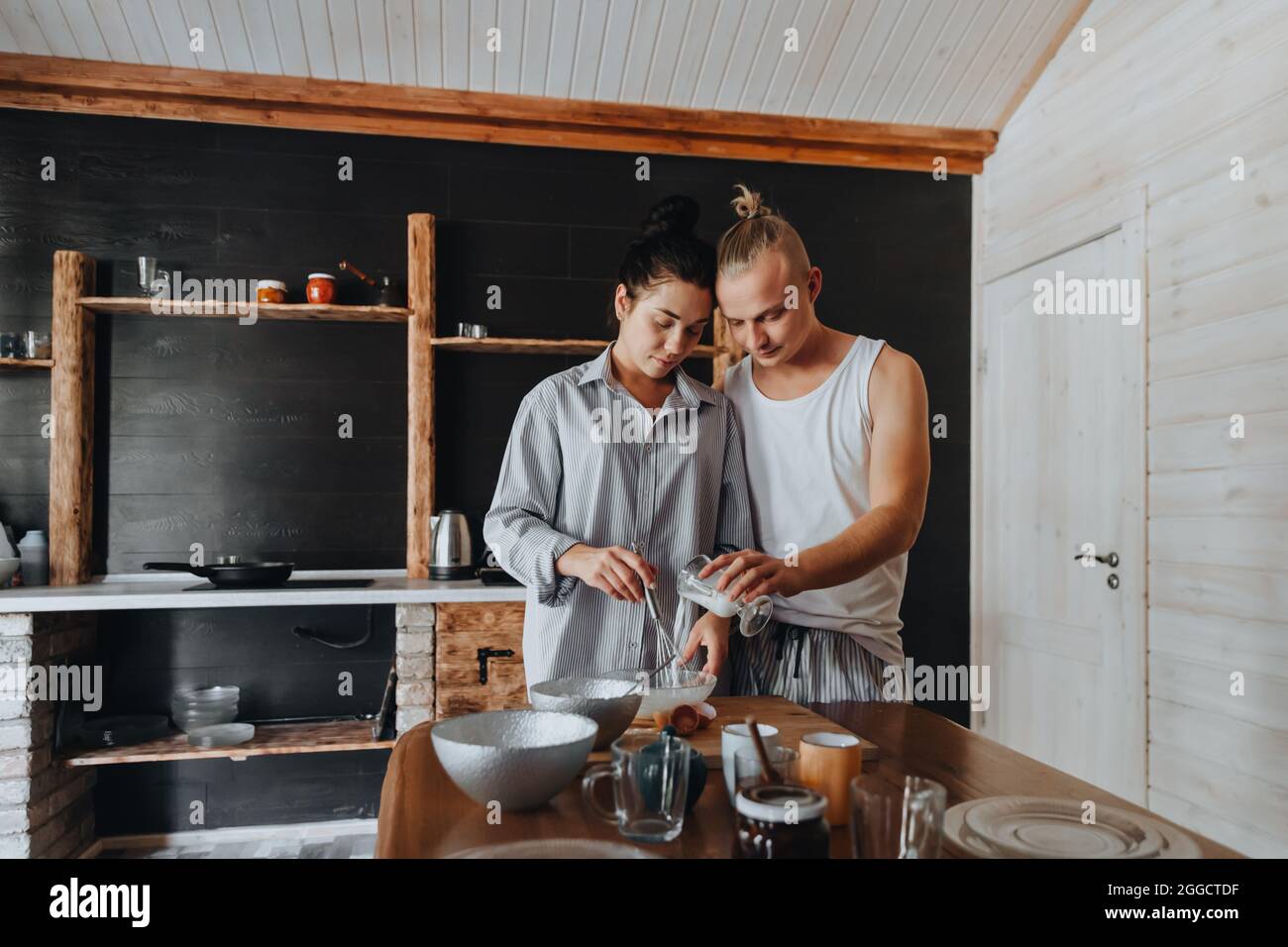 Young couple in love cook healthy food in the kitchen together Stock ...