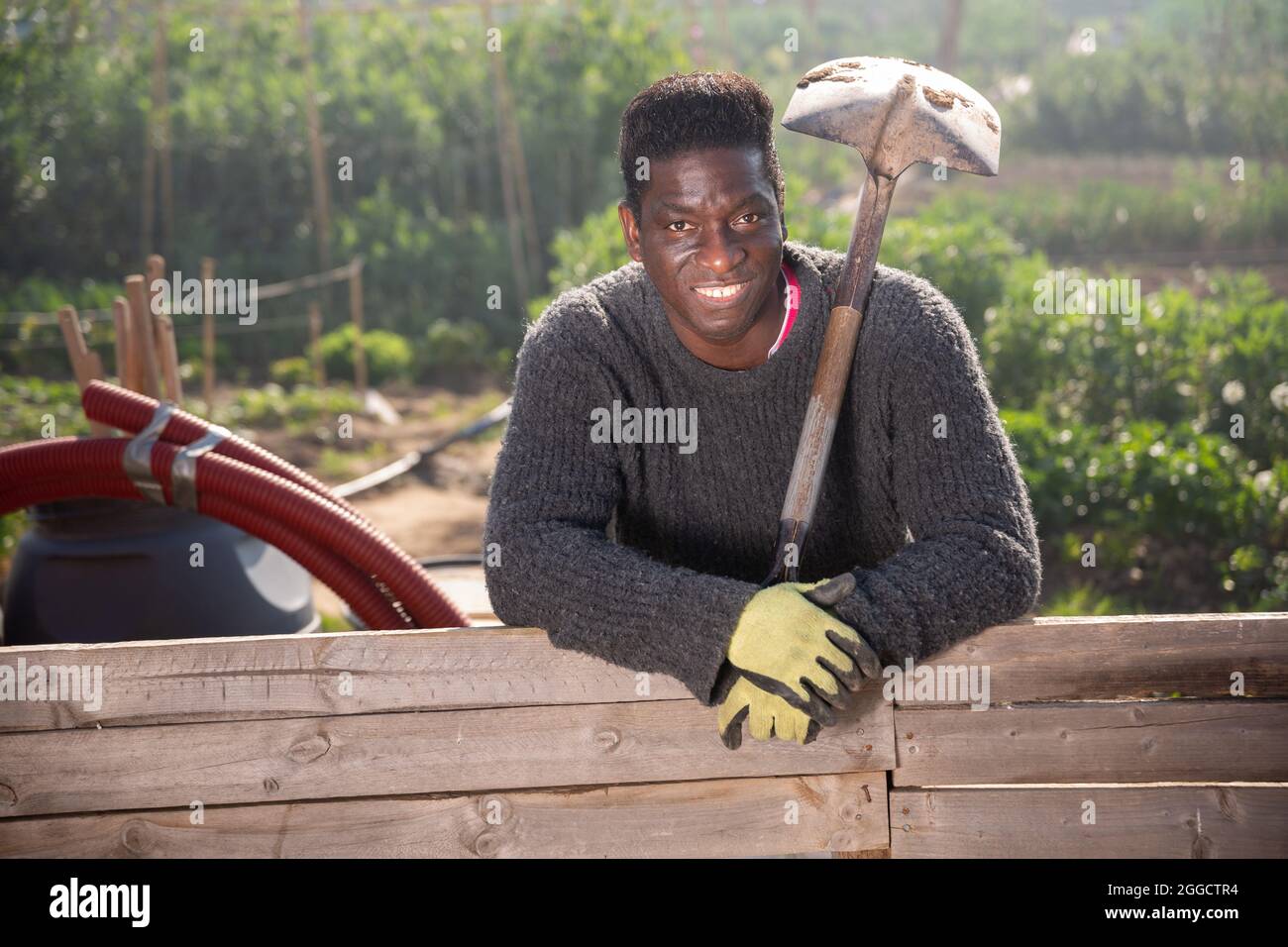 Portrait of american male gardener with shovel Stock Photo - Alamy