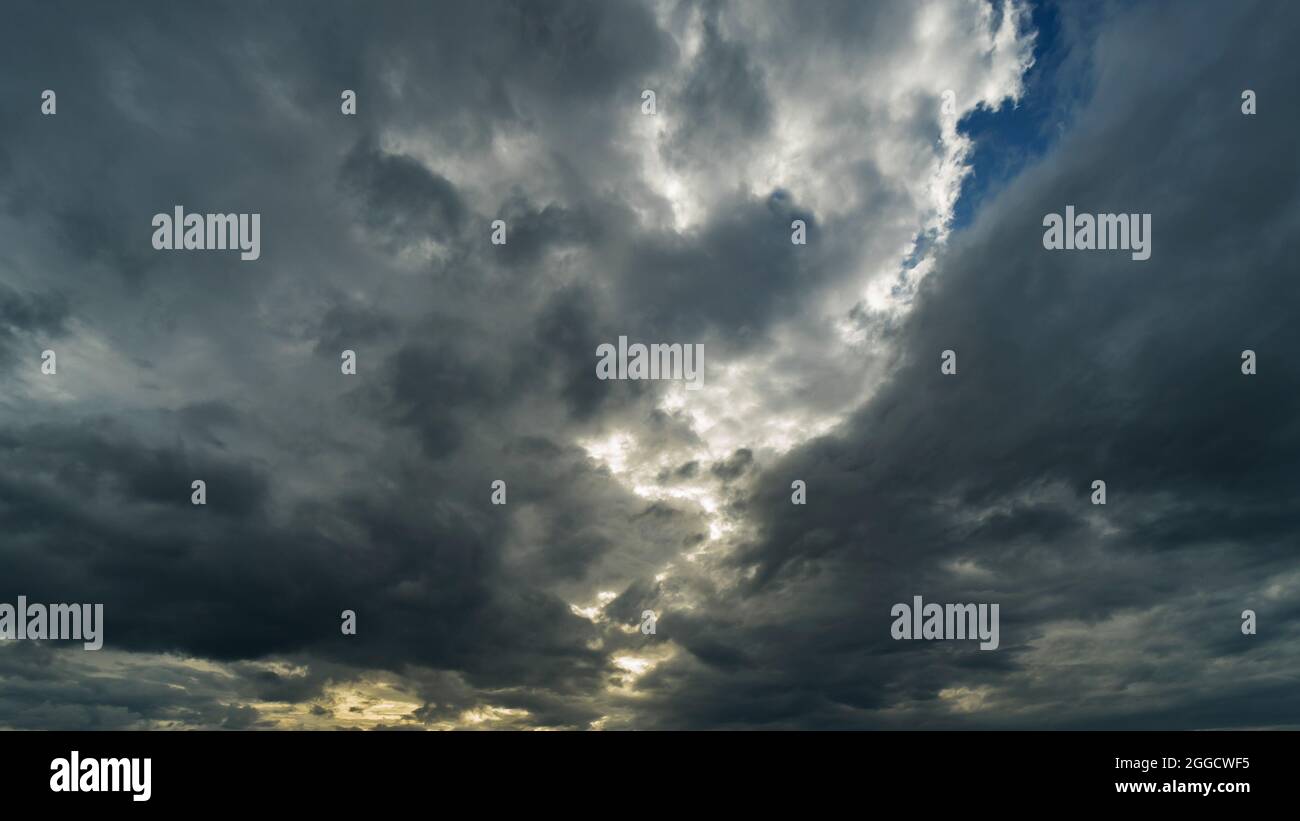 Dramatic storm clouds at dark sky Stock Photo - Alamy
