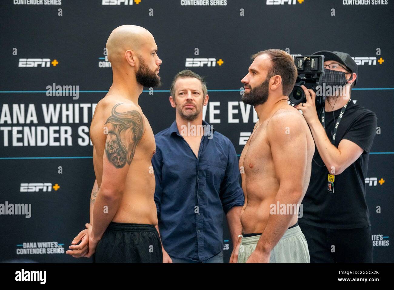 Matheus Scheffel (left) and Azamat Murzakanov (right) face-off with ...