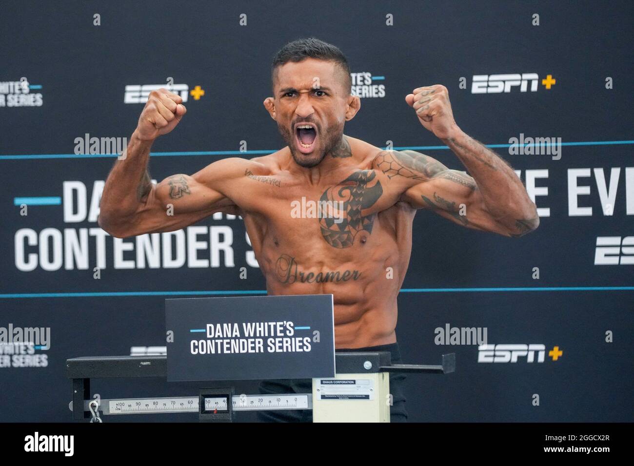 Joanderson Brito steps on the scale for the official weigh-ins at ...
