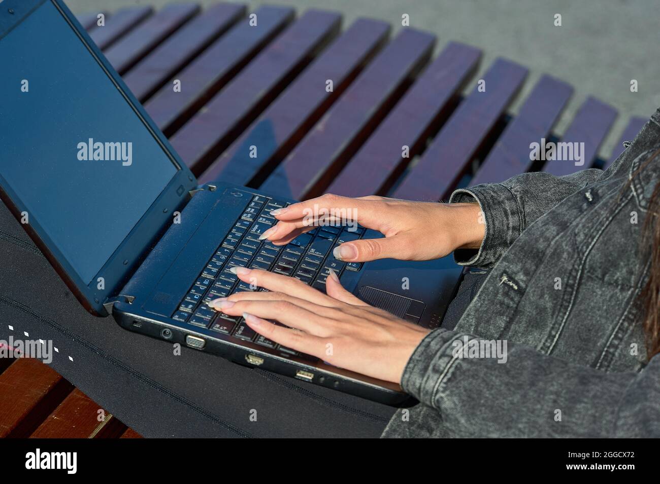 Female hands typing laptop keyboard close up Stock Photo - Alamy
