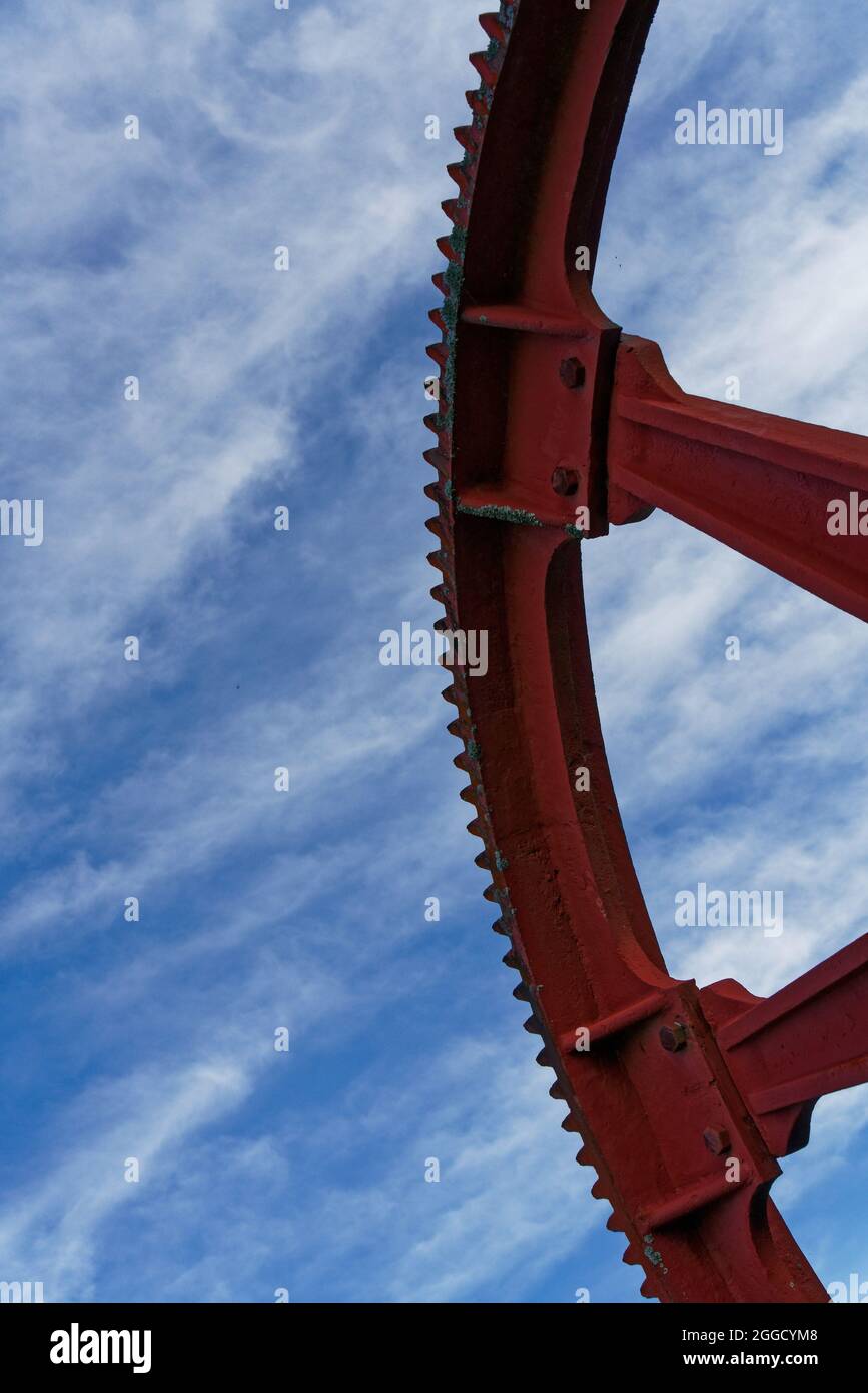 Giant cog wheel, a relic of mining days, west coast, New Zealand Stock ...