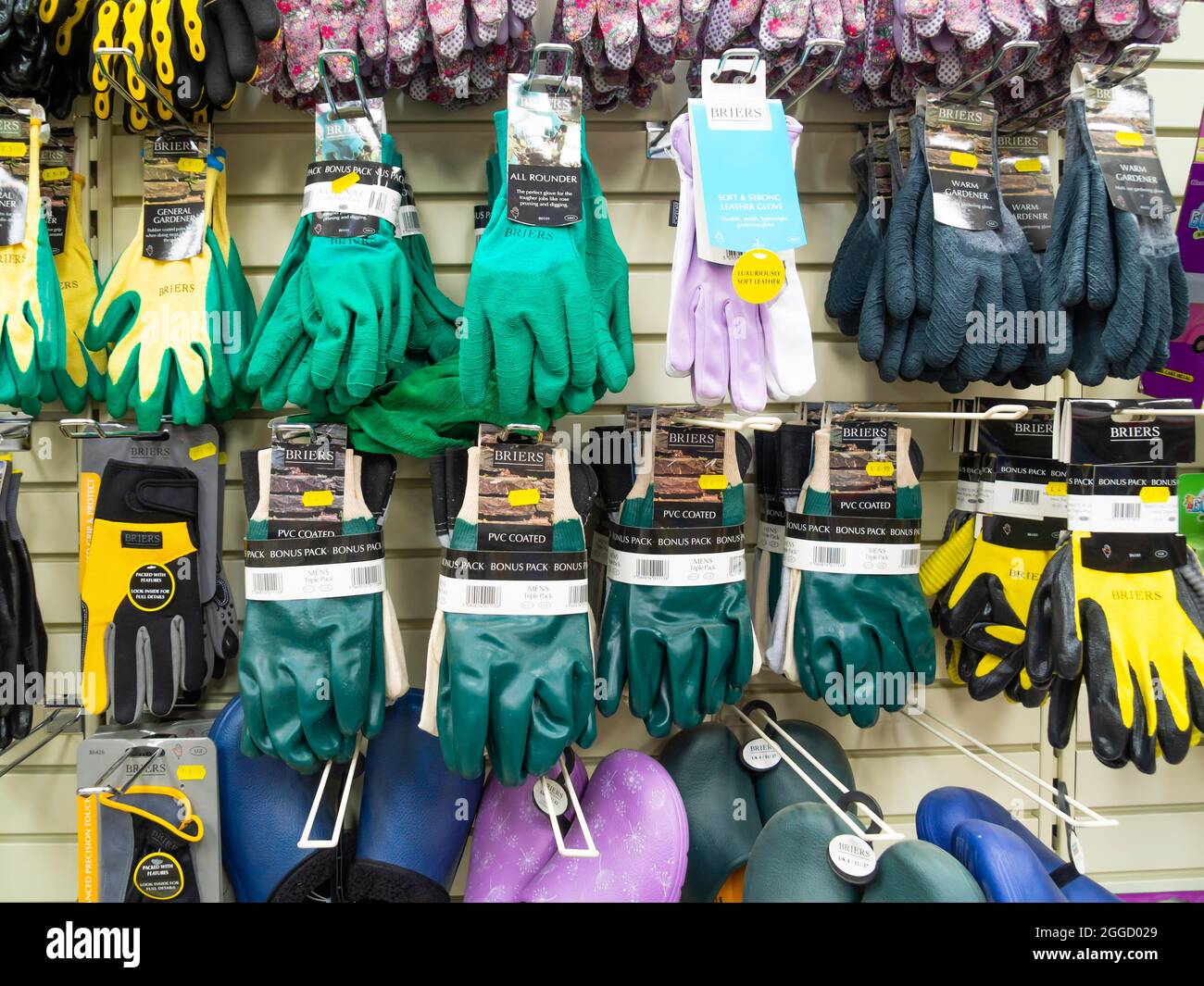 Display of several types of Work Gloves for sale in a farm shop Stock ...