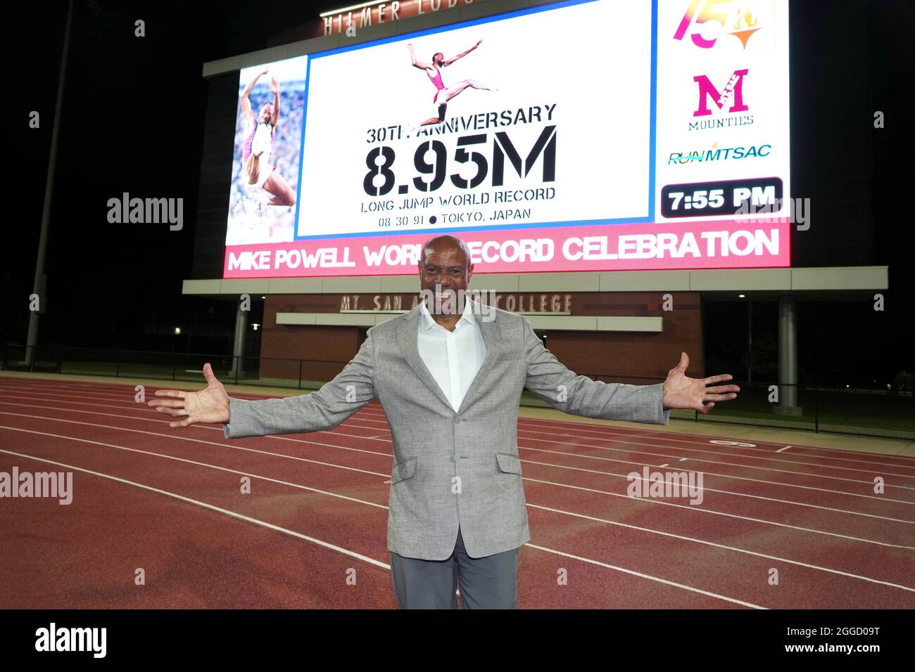Mike Powell (USA) poses at a ceremony to commemorate the 30th ...