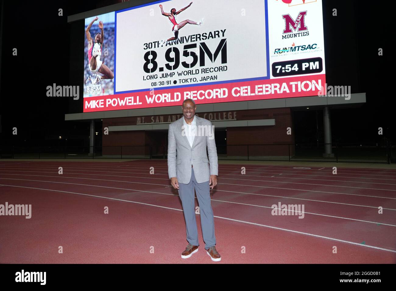Mike Powell (USA) poses at a ceremony to commemorate the 30th ...
