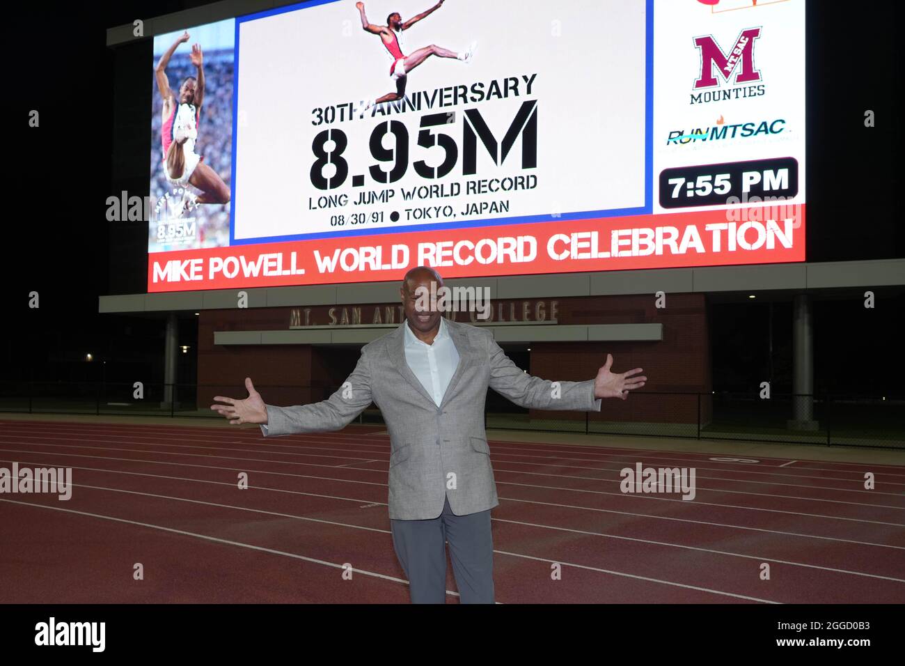 Mike Powell (USA) poses at a ceremony to commemorate the 30th ...