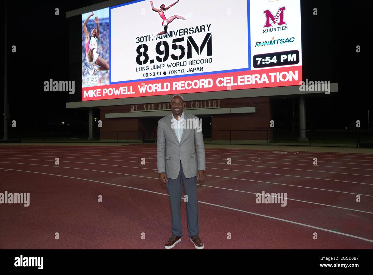 Mike Powell (USA) poses at a ceremony to commemorate the 30th ...