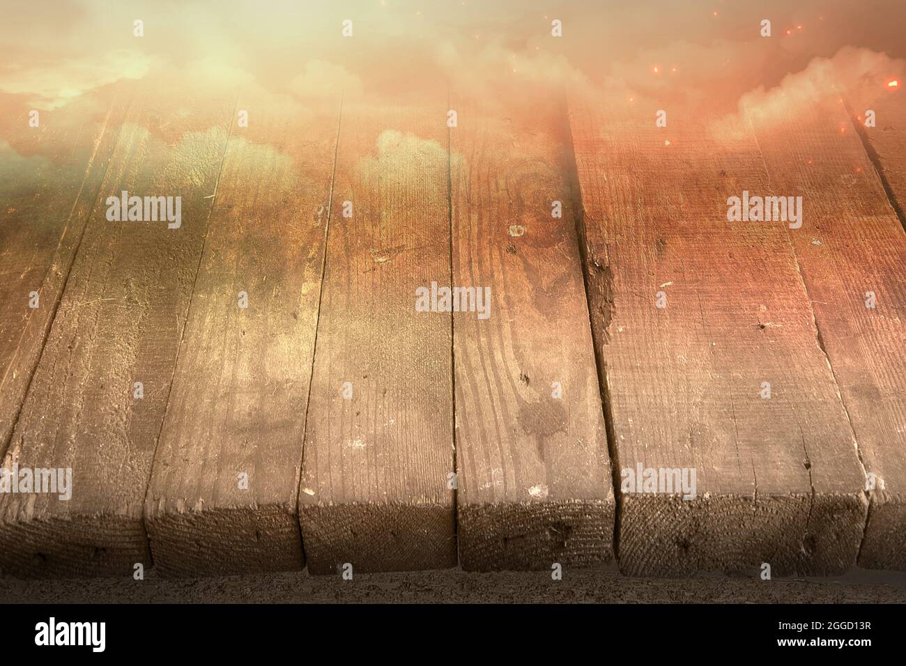 Wooden table with sparks and hot smoke background Stock Photo - Alamy