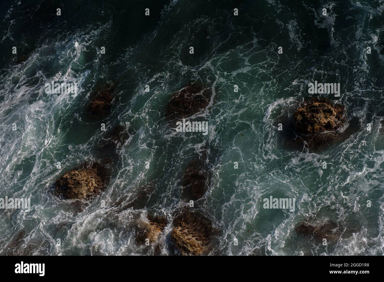 Ocean wave background breaking sea water rocky shore rough seas ...