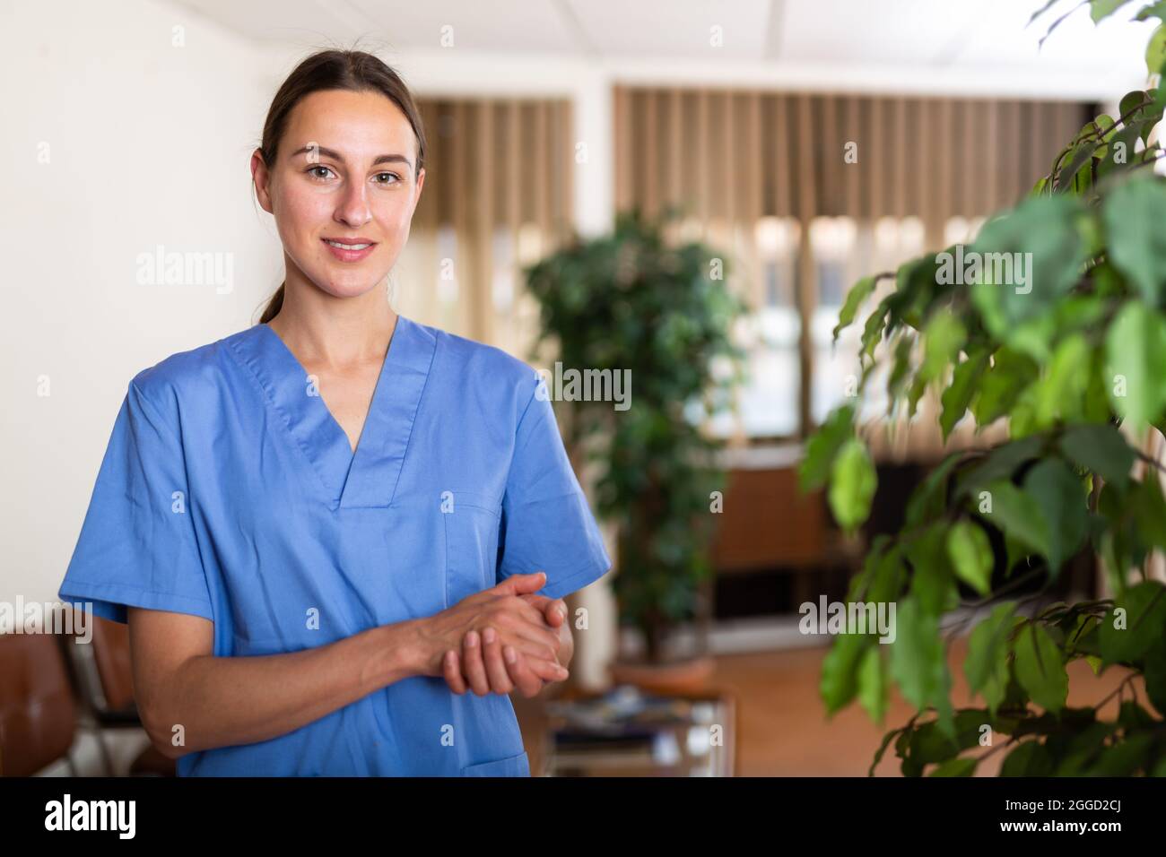 Positive female doctor posing in private clinic Stock Photo - Alamy