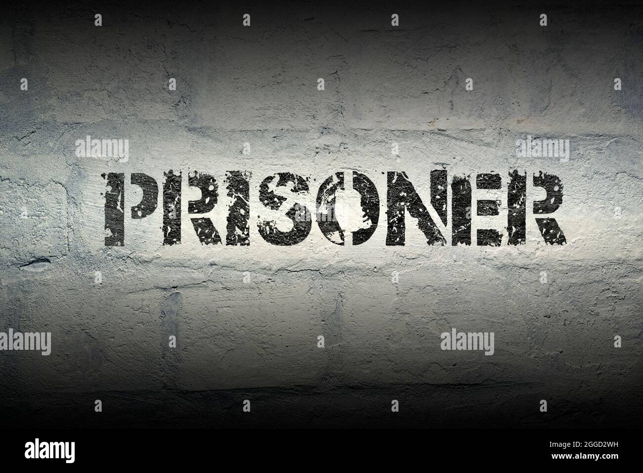 prisoner word stencil print on the grunge white brick wall Stock Photo ...