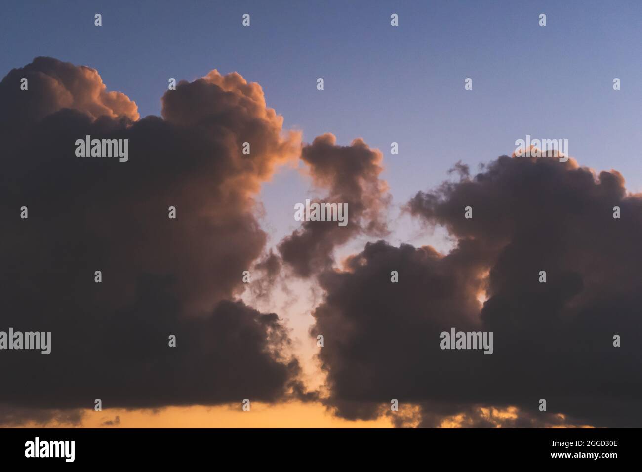 Dark and moody clouds at sunset Stock Photo - Alamy