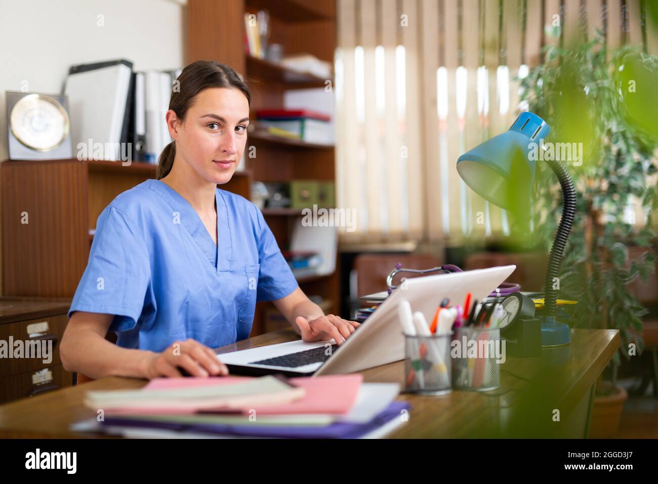 Doctor works in front of computers in private clinic Stock Photo - Alamy