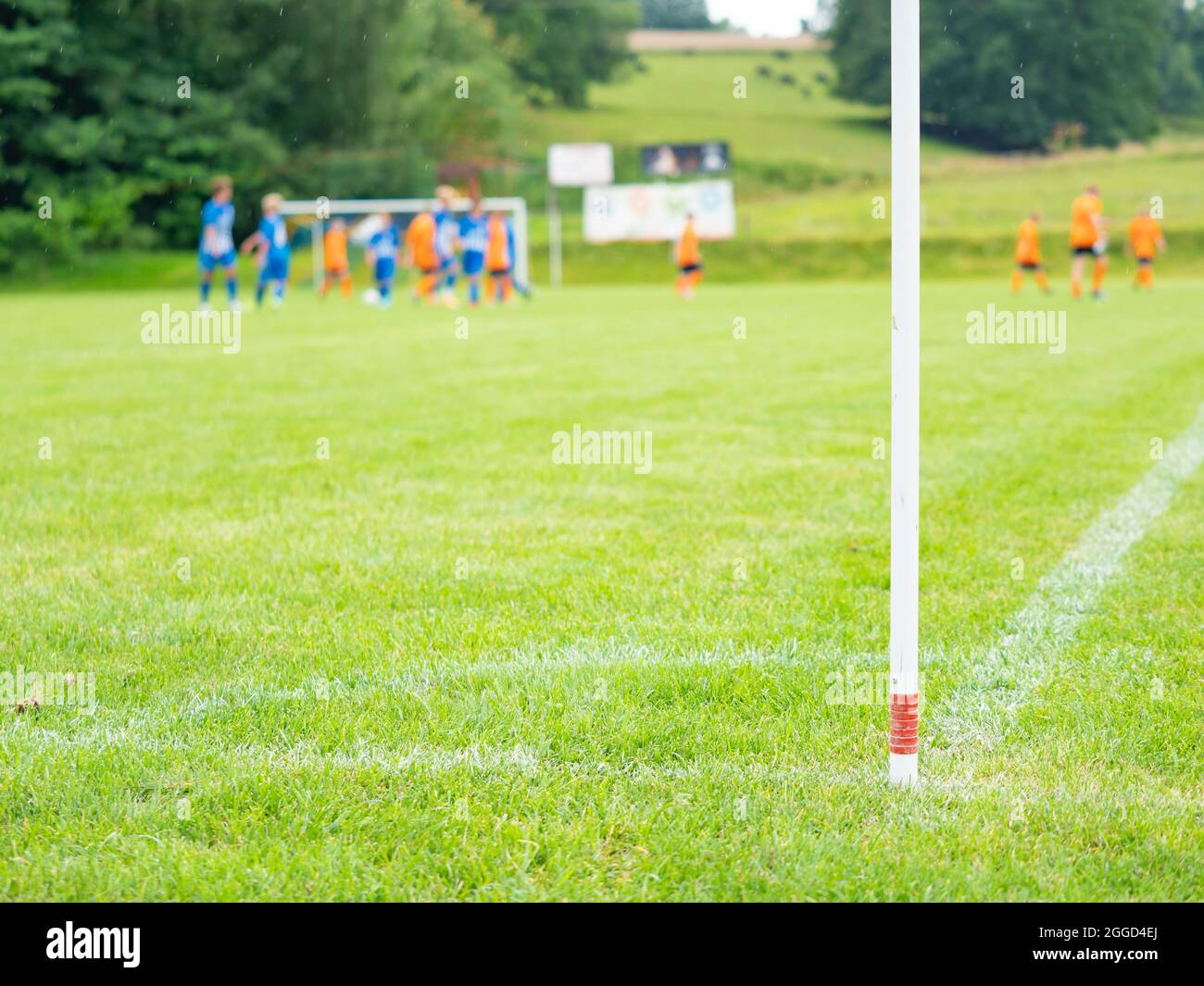 Field corner of outdoor football playground, football teams playing out ...