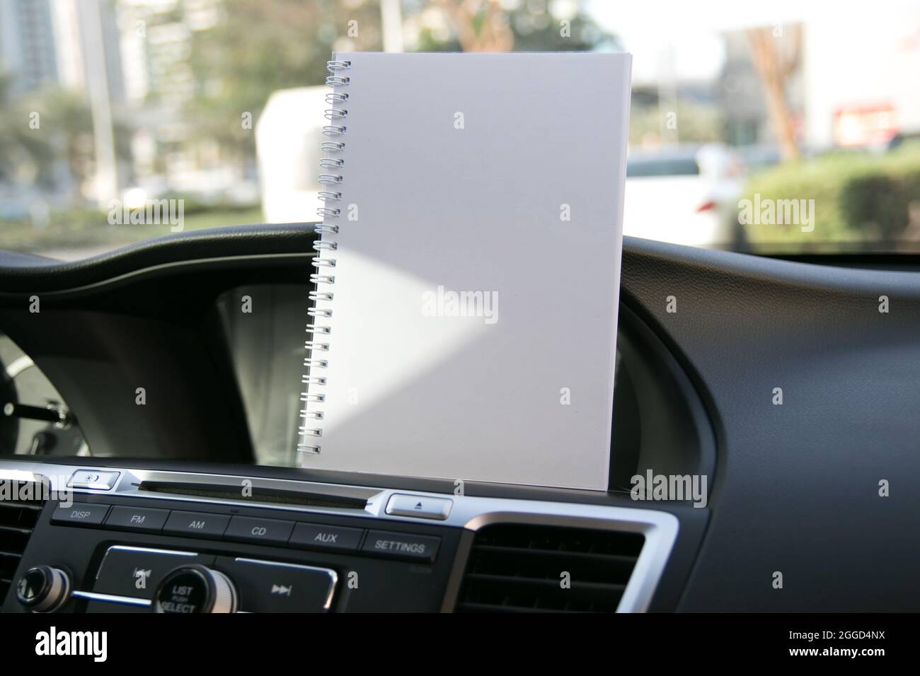 Open Notebook with Blank White Empty Clear Pages on the Car Control ...