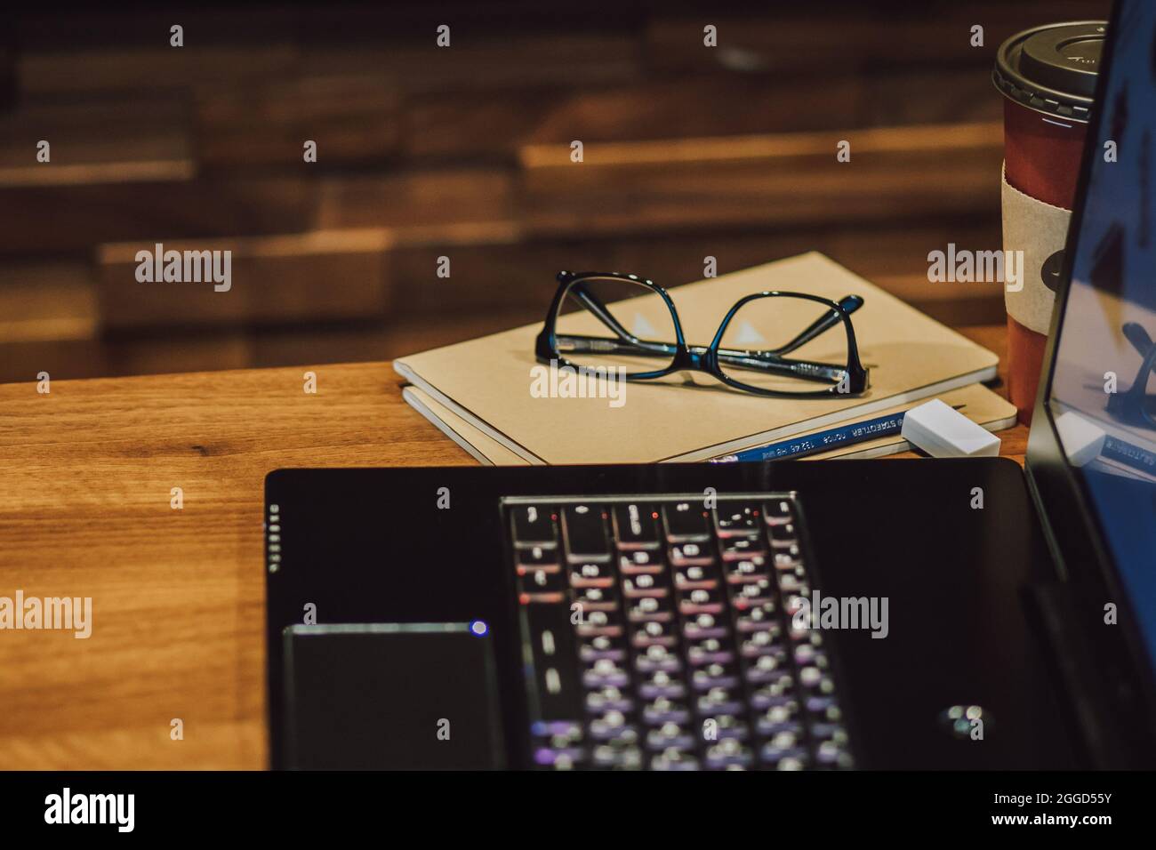 Working Environment Wooden Desk with Coffee and Laptop with Notebook ...