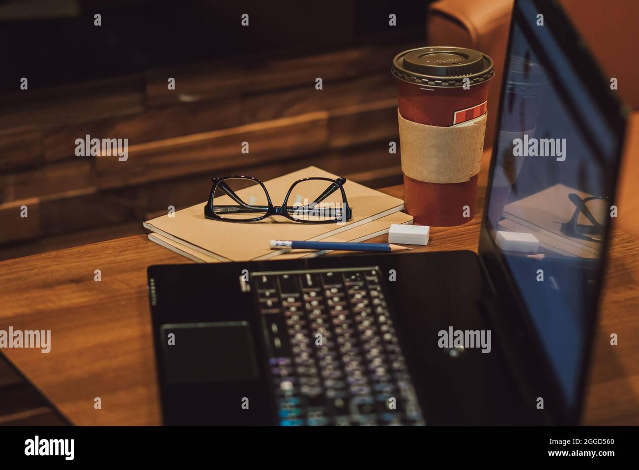 Working Environment Wooden Desk with Coffee and Laptop with Notebook ...