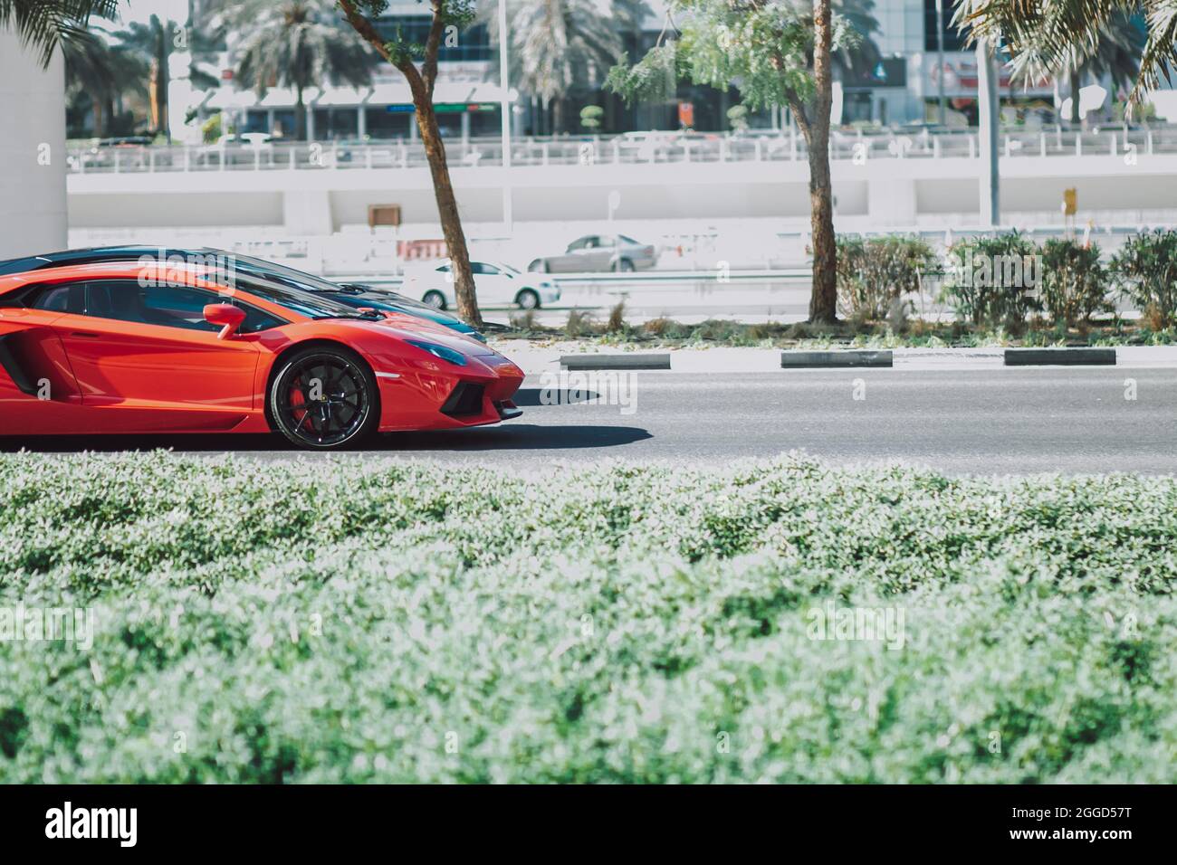Driving Super Luxury Red Car on the Road Stock Photo - Alamy