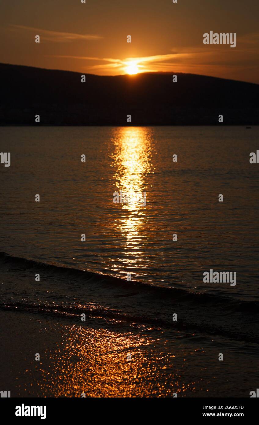 People swim in morning sea hi-res stock photography and images - Alamy