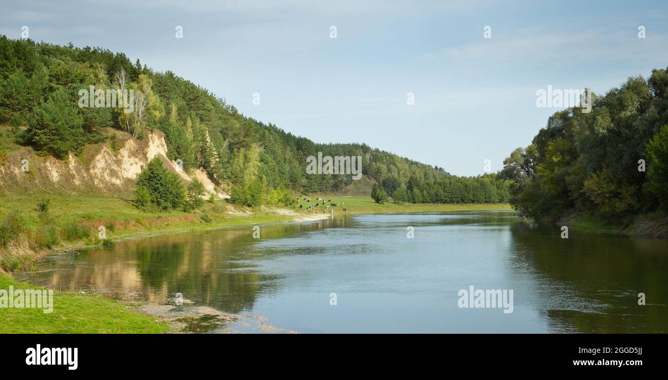 Quiet summer river and green hills Stock Photo - Alamy