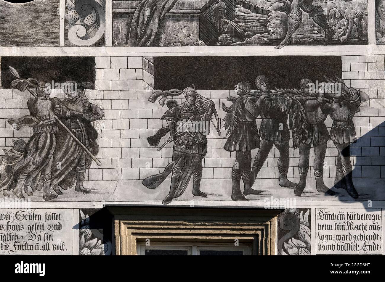 Huntsmen carry a spear and longbow and control hounds on leads as they ...