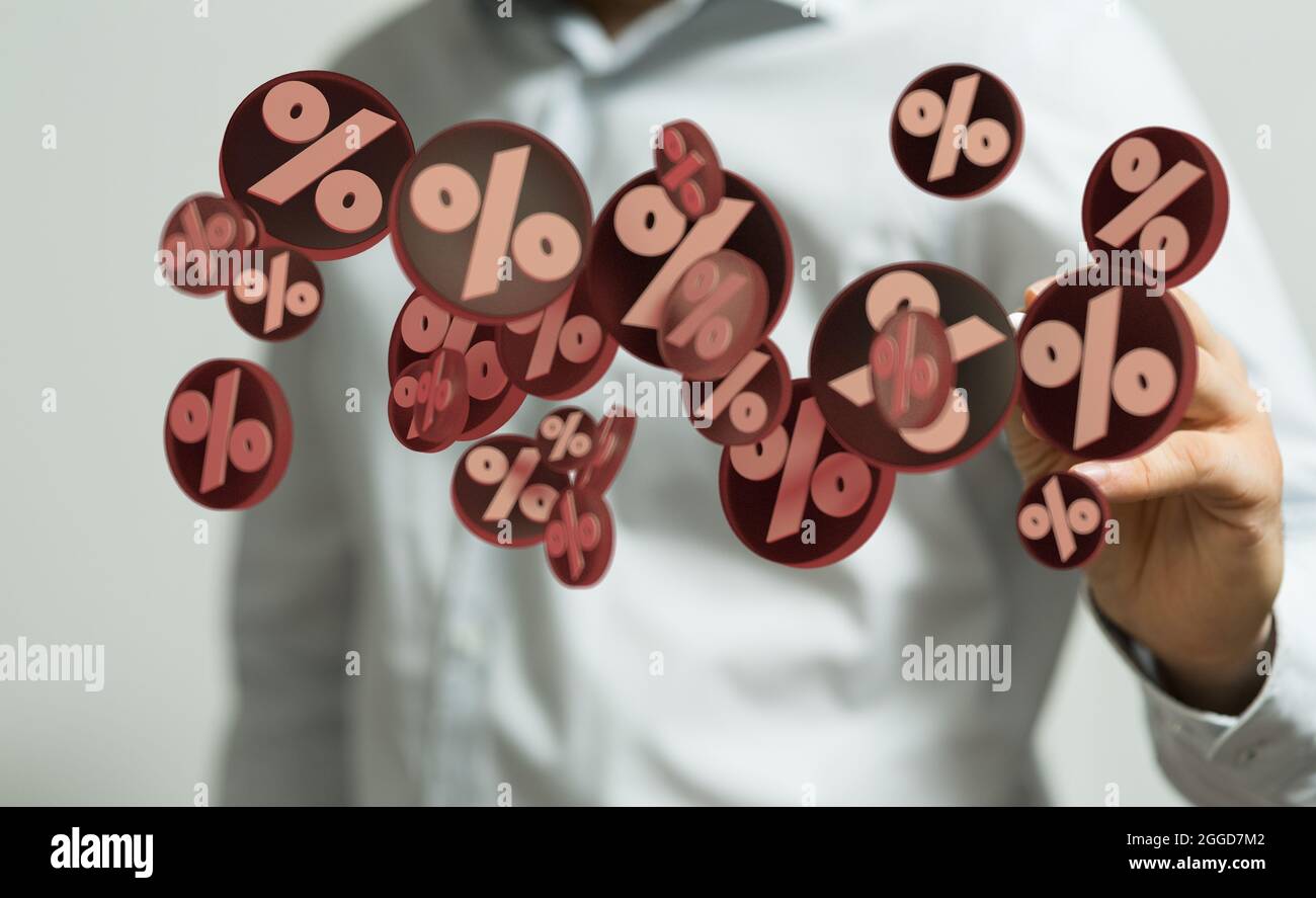 Closeup of floating 3d percent signs with a man in the background Stock ...