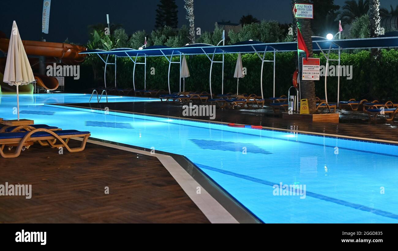 Evening lighting of the hotel pool Stock Photo - Alamy