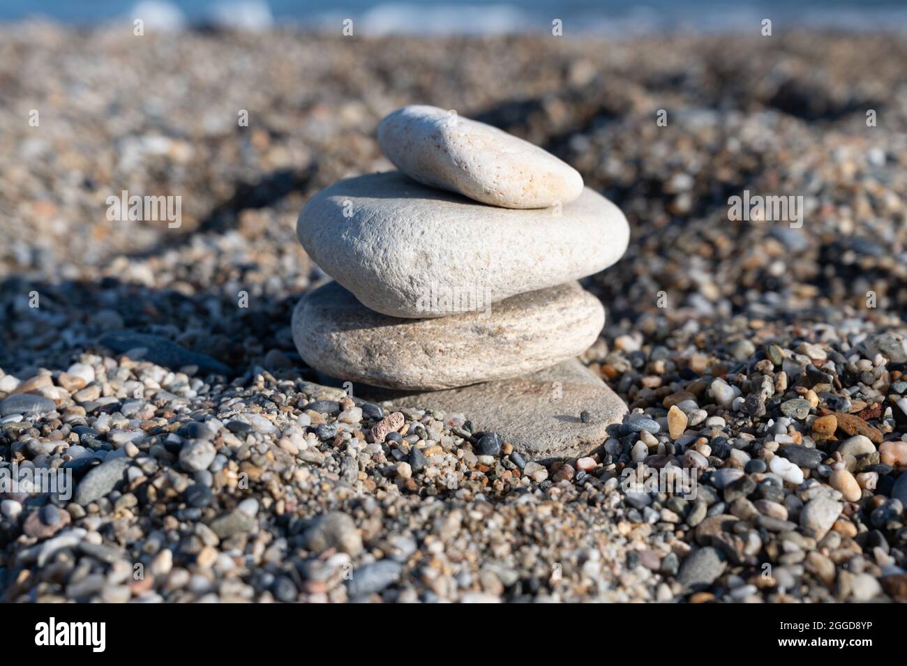 Spa pebbles on the background of the sea Stock Photo - Alamy