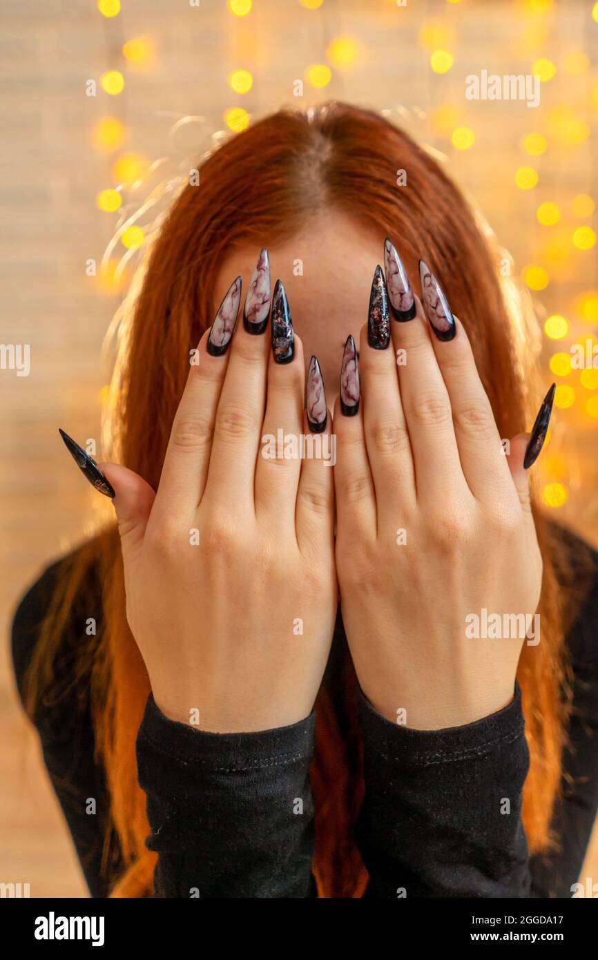 Halloween ginger Witch woman with long scary nails. Garland on ...