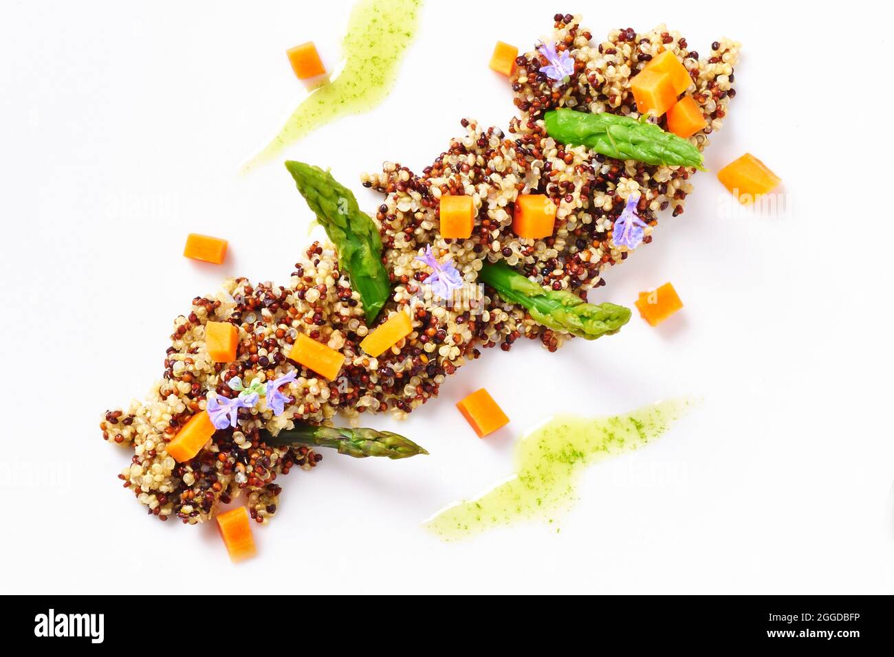 Quinoa steamed and sauteed in a pan with asparagus and carrots Stock ...