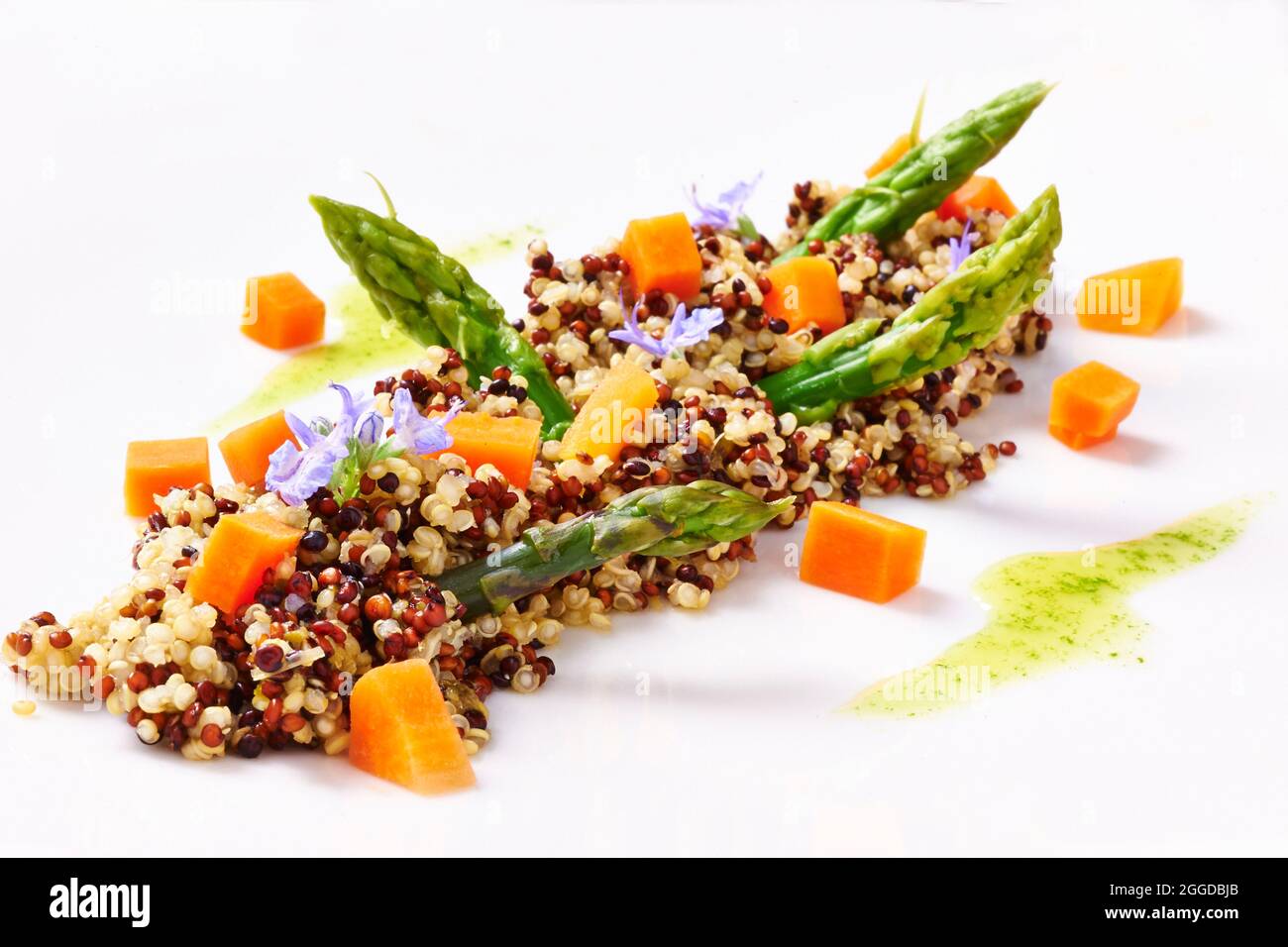 Quinoa steamed and sauteed in a pan with asparagus and carrots Stock ...