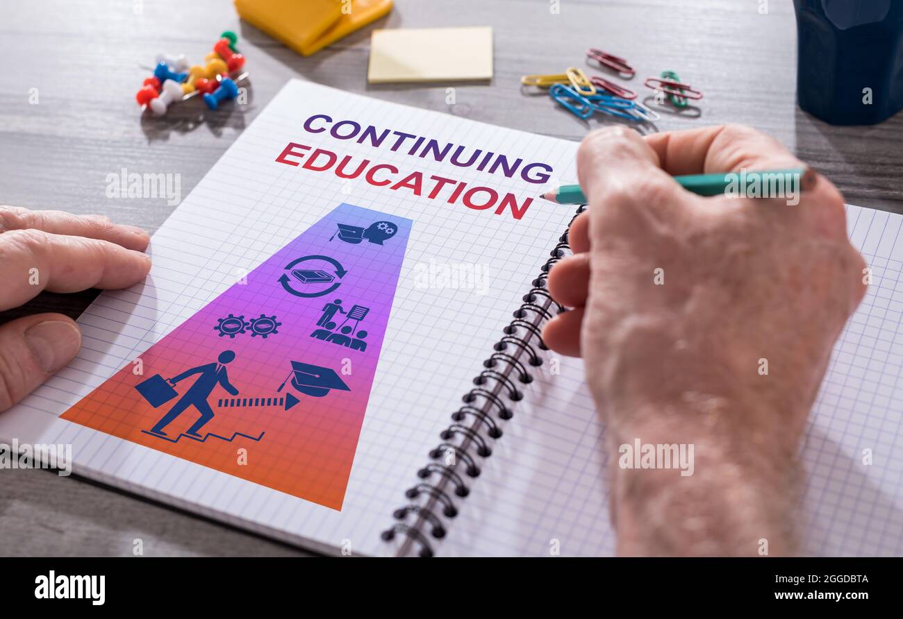 Hand drawing continuing education concept on a notepad Stock Photo - Alamy