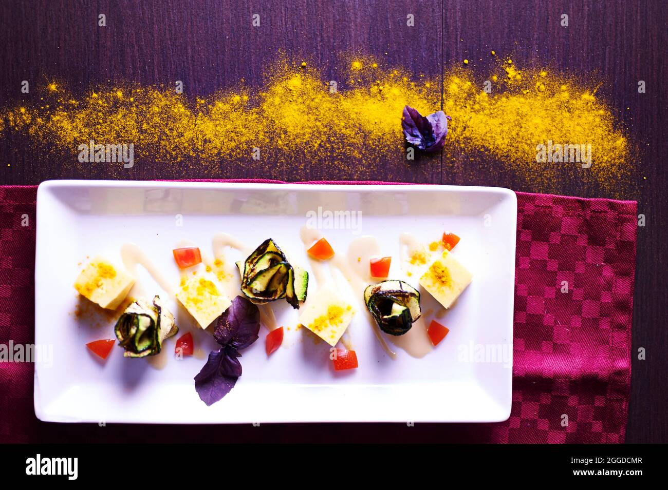 chickpea cheese with tumeric served with tomato zucchini, tahina and ...