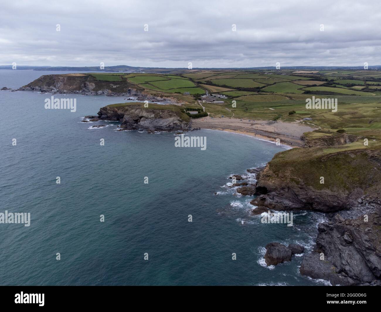 aerial drone around church cove and mullion golf course cornwall uk ...