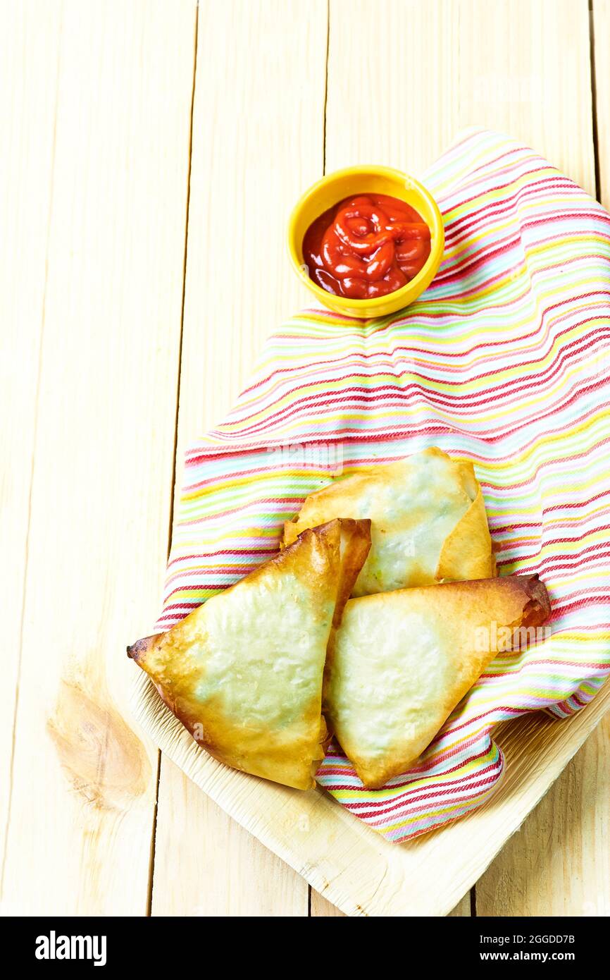 vegetarian samosa served with tomato sauce Stock Photo - Alamy