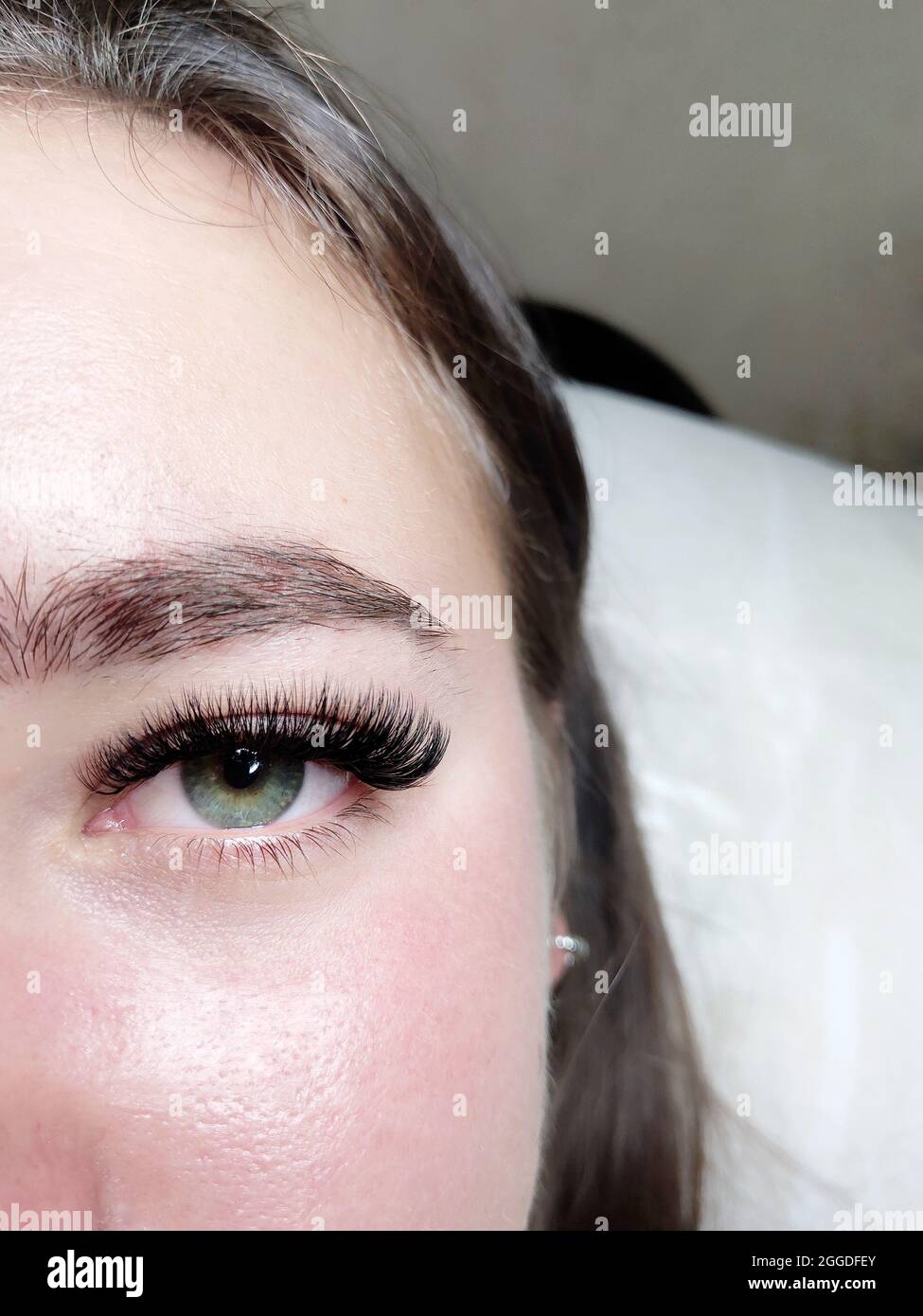 Lash extensions in beauty salon macro eye top view Stock Photo - Alamy