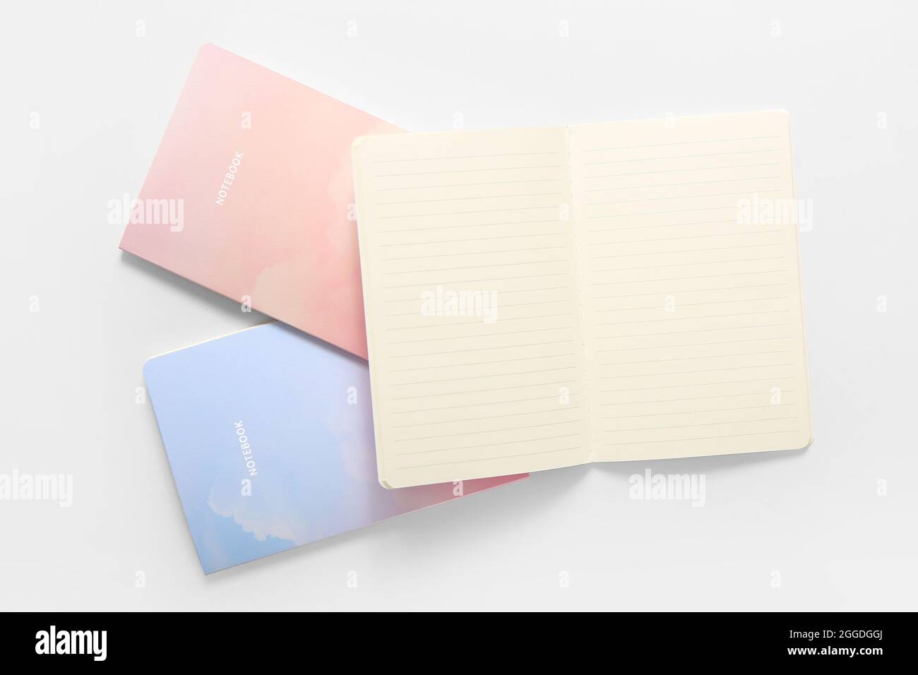 Stylish notebooks on white background Stock Photo - Alamy