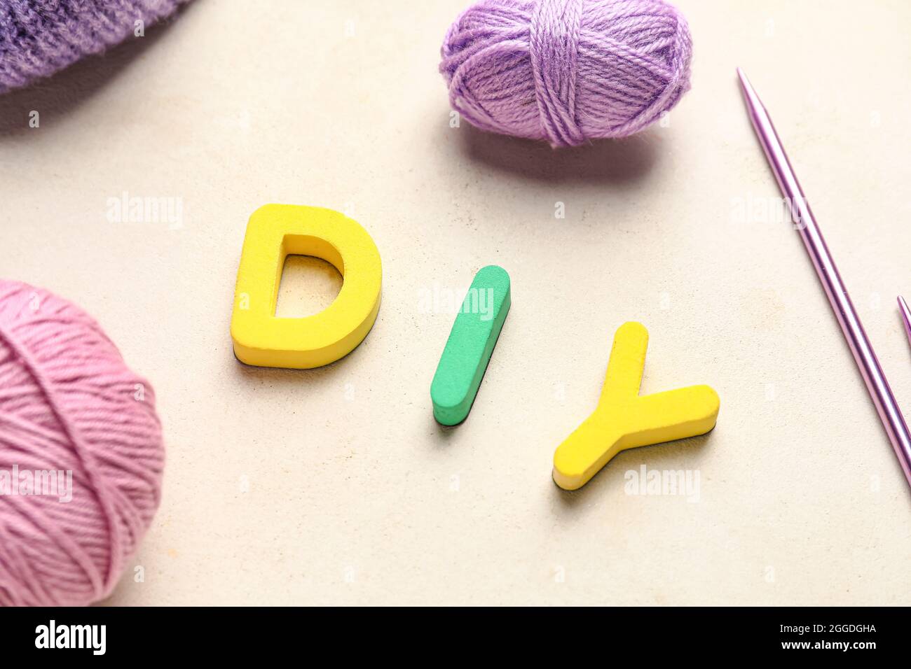 Word DIY and knitting yarn on white background Stock Photo - Alamy