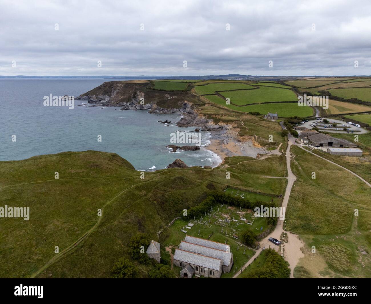 aerial drone around church cove and mullion golf course cornwall uk ...