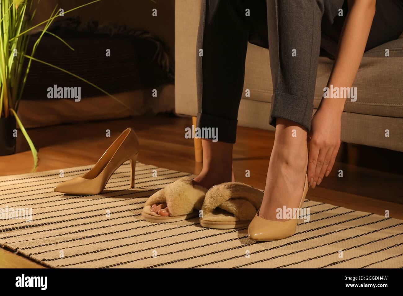 Closeup woman putting on beige hi-res stock photography and images - Alamy